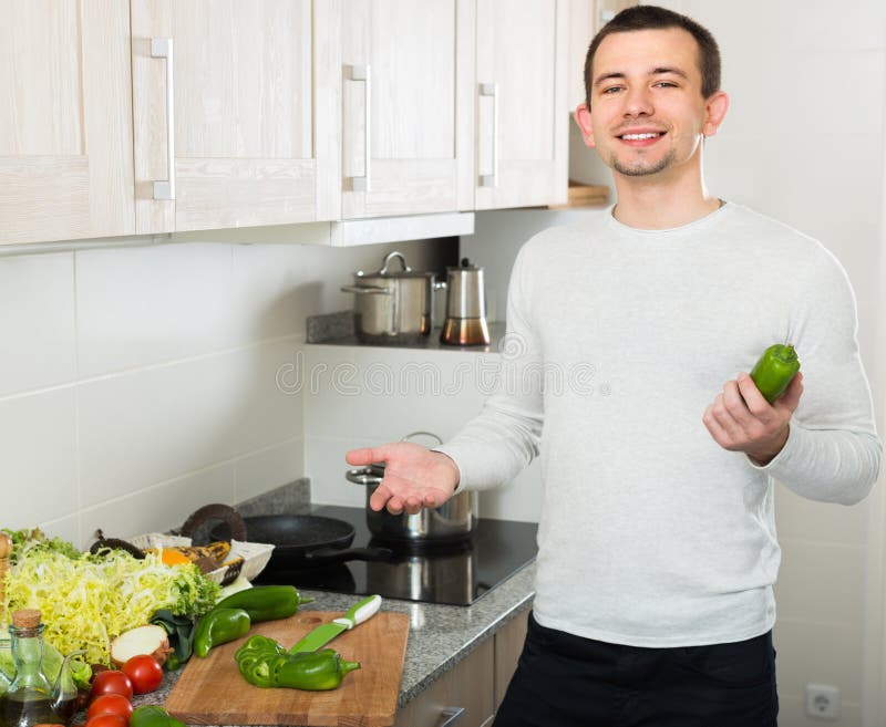 Man Cooks with Vegetables at Kitchen Stock Photo - Image of homework ...