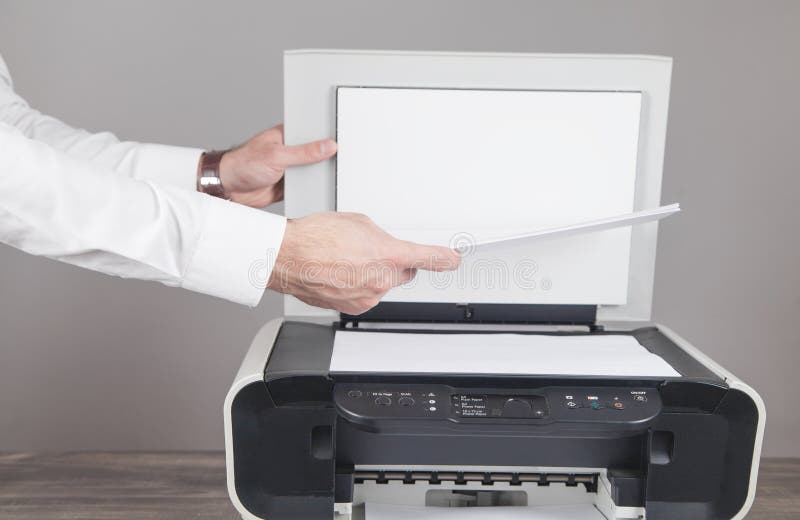 Man Copying and Scanning Documents in Office Stock Image - Image of ...