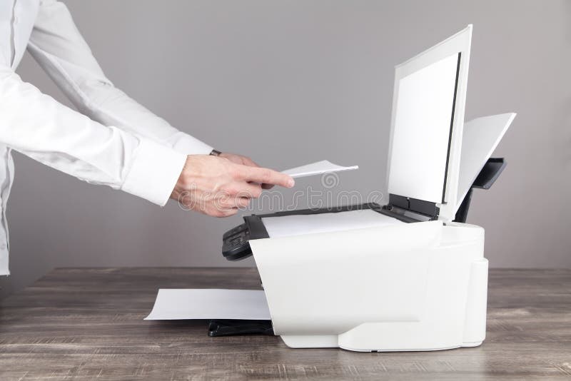Man Copying and Scanning Documents in Office Stock Photo - Image of ...