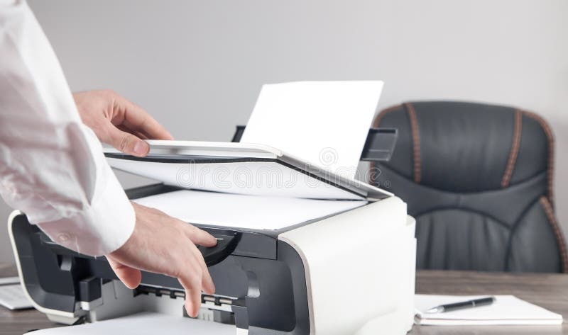 Man Copying and Scanning Documents in Office Stock Photo - Image of ...