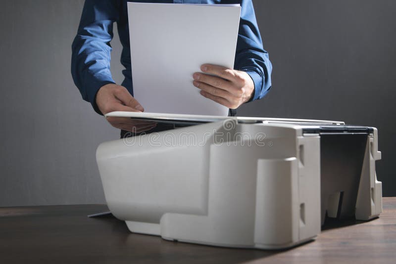 Man Copying and Scanning Documents in Office Stock Image - Image of ...