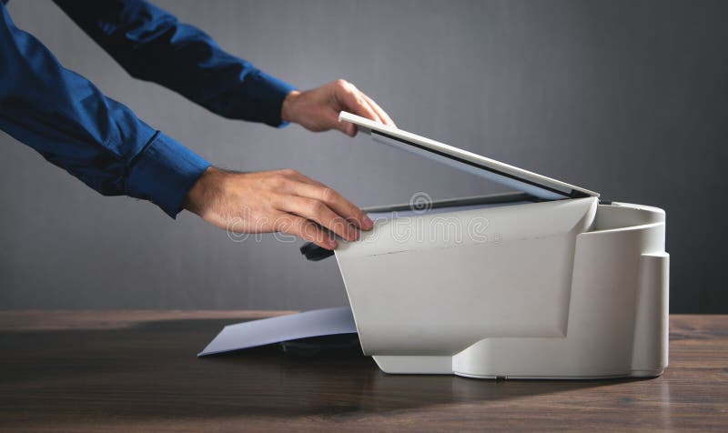 Man Copying and Scanning Documents in Office Stock Image - Image of ...