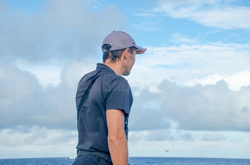 The Man Costs Ashore and Looks in the Sea Stock Photo - Image of look ...