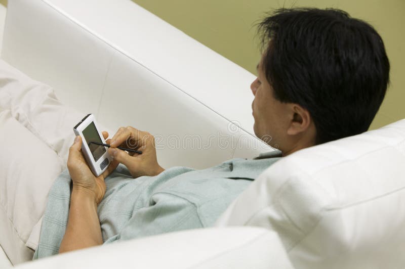 Man looking at PDA stock image. Image of organizer, american - 5497135