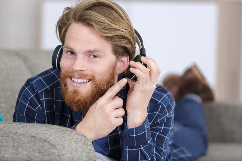 Man on Couch Watches Movie on Mobile Phone Stock Image - Image of ...