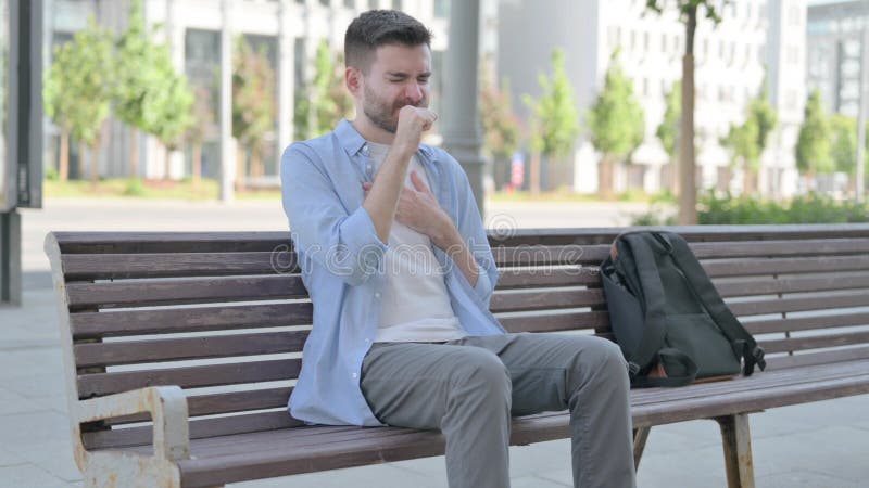 Young Man Coughing while Sitting on Bench Stock Image - Image of ...