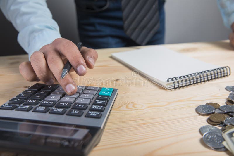 A Man Counting on a Calculator Stock Image - Image of analyzing ...