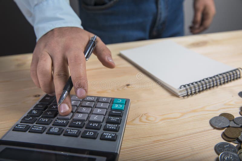 A Man Counting on a Calculator Stock Image - Image of calculator, data ...