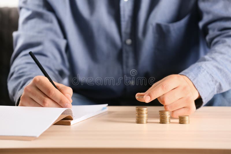 Man Counting Coins at Table. Savings Concept Stock Image - Image of ...