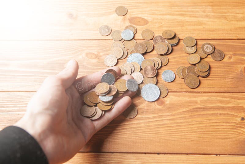Man Counting Coins on the Table Stock Photo - Image of light, deposit ...
