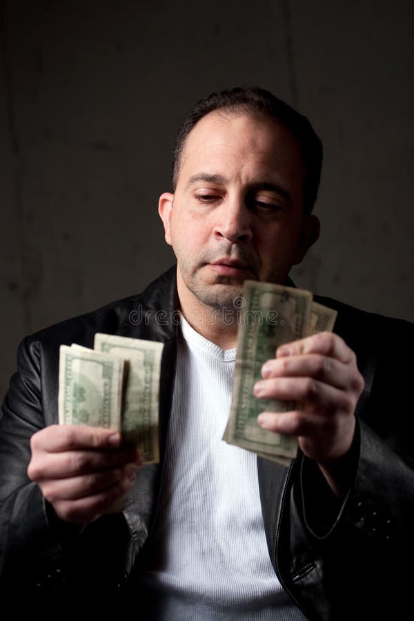 Man with Money stock photo. Image of illegal, earnings - 14255572