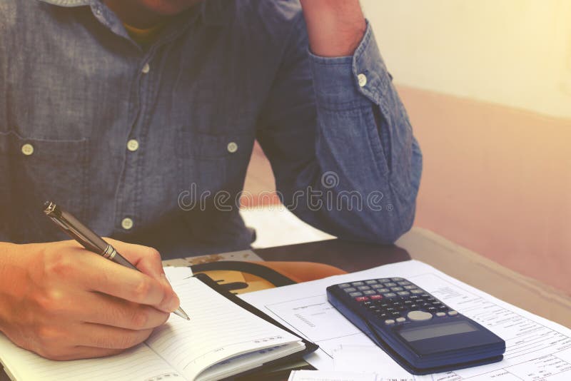 Man Counting Using Calculator and Stress in Problem with Expense Stock ...
