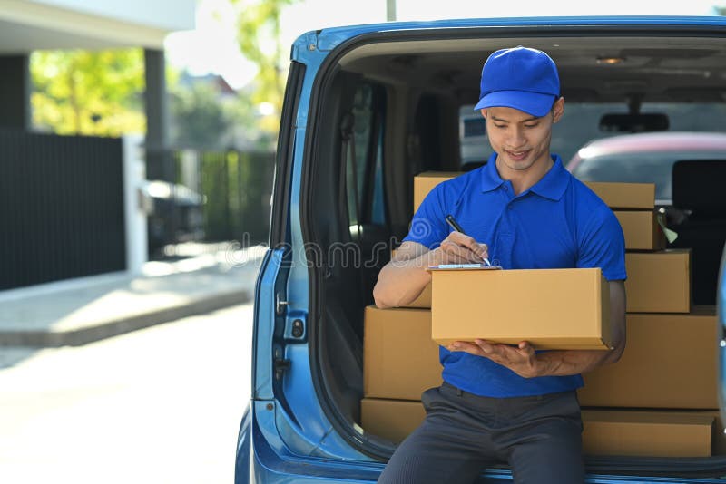 Man Courier Sitting in Open Delivery Van and Checking Checking Address ...