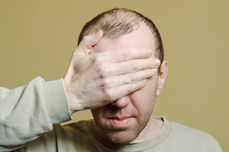The Man Covered His Eyes with His Hand. Portrait of a Young Man Making ...