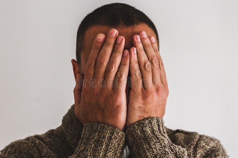 A man covering is face stock image. Image of adult, confident - 139590173
