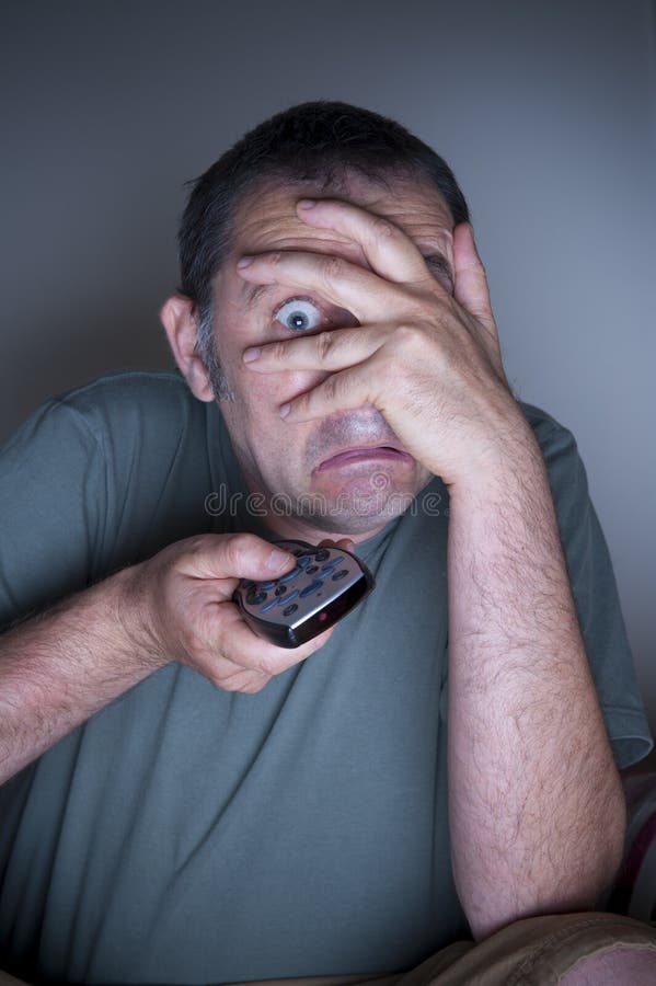 Man Covering Face Watching Tv Stock Image - Image of sitting, aged ...