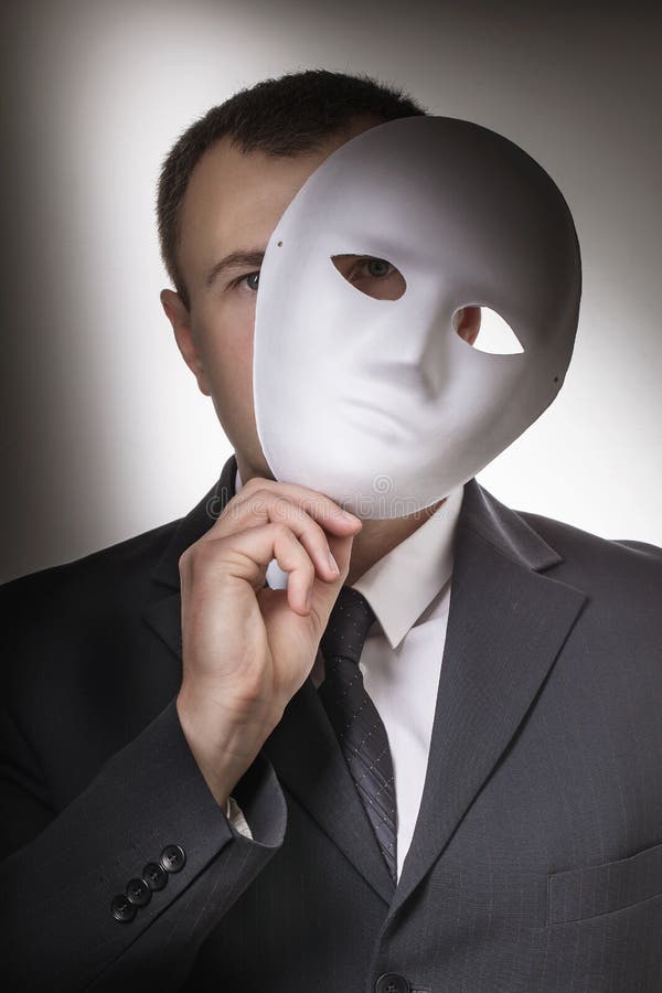 Man Covering His Face with a Mask. Concept on the Topic of Secrecy of ...