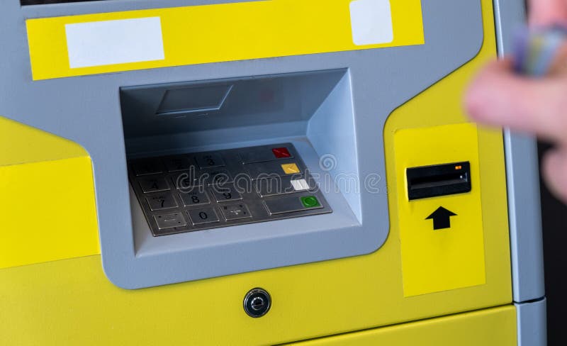 Man Covering His Hands Whilst Entering His PIN at an ATM Stock Image ...