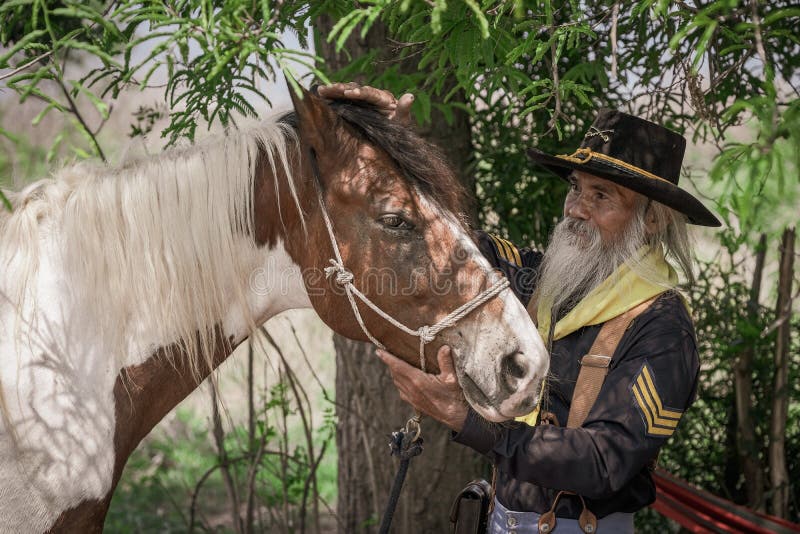 Man in a Cowboy Outfit with His Horse Stock Image - Image of people ...