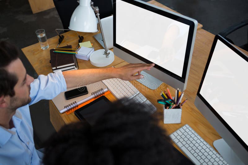 Man and Coworker Discussing Over Desktop Pc Stock Photo - Image of ...