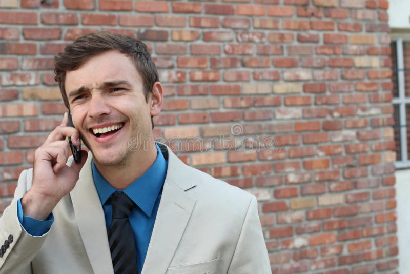 Man Cracking Up after Listening To Joke on Mobile Phone Stock Photo ...