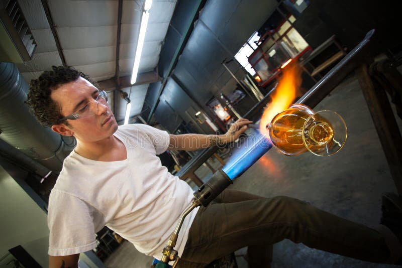 Man Creating Glass Object stock image. Image of melting - 30696553