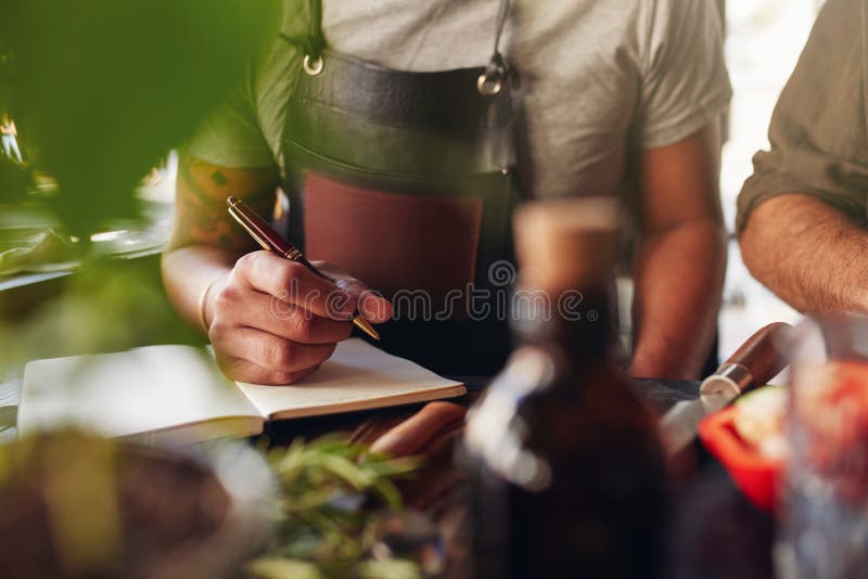 Man Creating New Cocktail Recipe and Taking Notes Stock Image - Image ...
