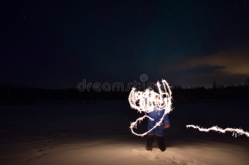 Man Creating Shape with Handheld Fireworks Stock Photo - Image of shine ...