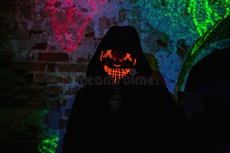 Man in Creepy Glowing Mask in Abandoned Building. Horror Concept Stock ...