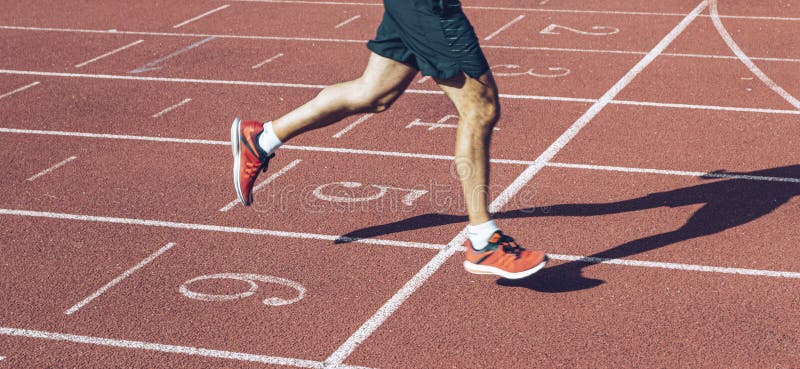 Man Crossing the Finish Line at the Track Stock Photo - Image of ...