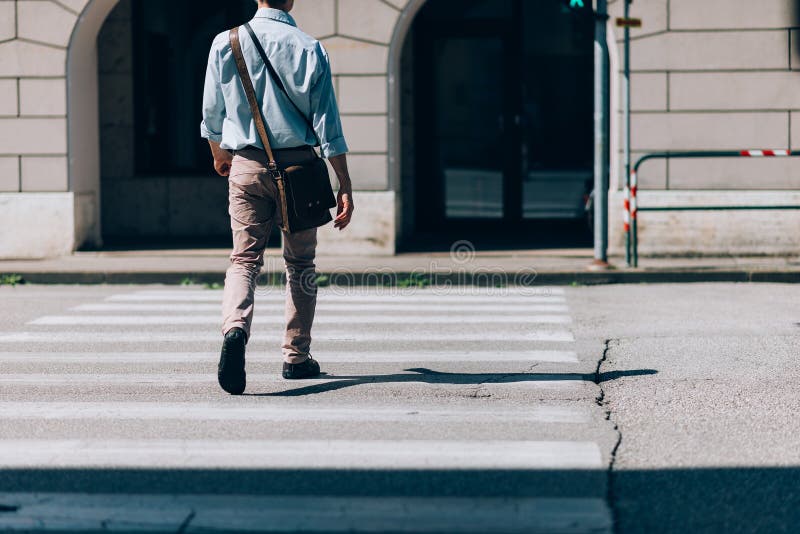 Man crossing the street stock image. Image of pedestrian - 78052021