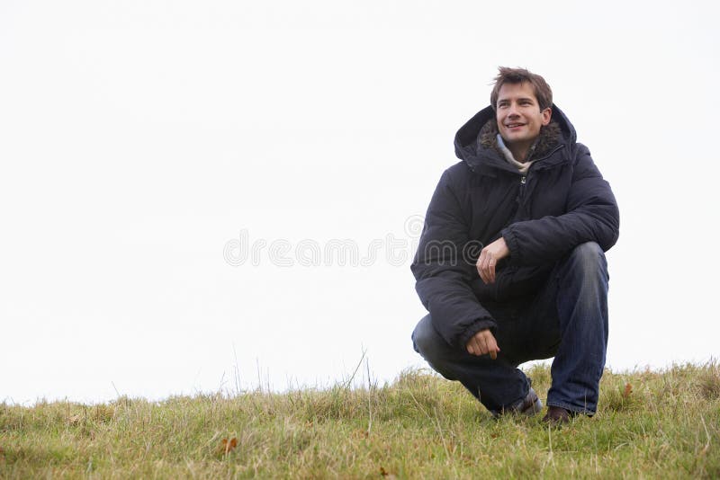 Man Crouching in Park stock photo. Image of copy, countryside - 7942036