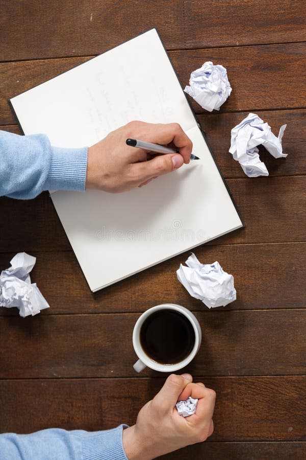 Man Crumpling Paper while Writing on Notepad Stock Image - Image of ...