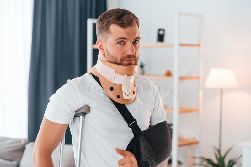Man with Crutches is at Home Indoors. Having Injuries Stock Image ...