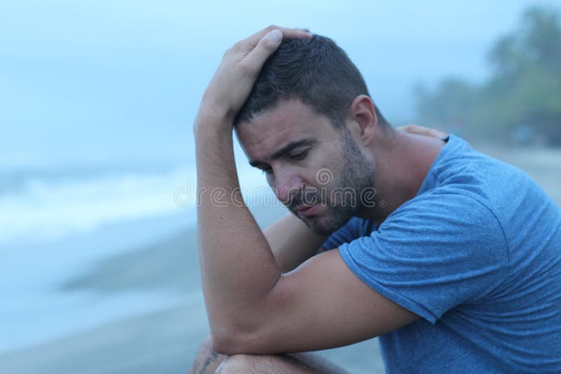 Man crying at the beach stock photo. Image of desperate - 137244068