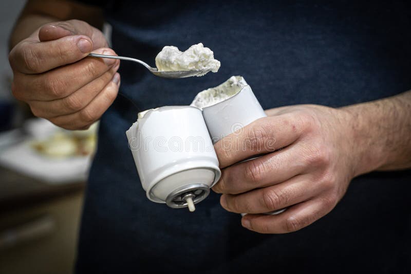 The Man Cut a Can of Cream and Eats the Remnants of the Cream. Damaged ...