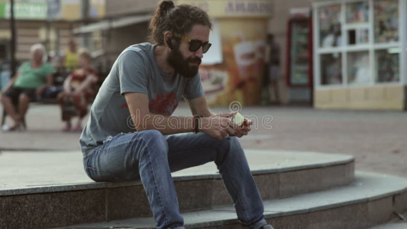 Man Cut and Eating Apple in the Park Stock Video - Video of bench, male ...