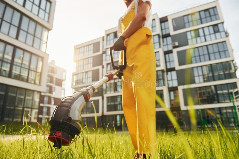 Man Cut the Grass with Lawn Mover Outdoors in the Yard Stock Photo ...