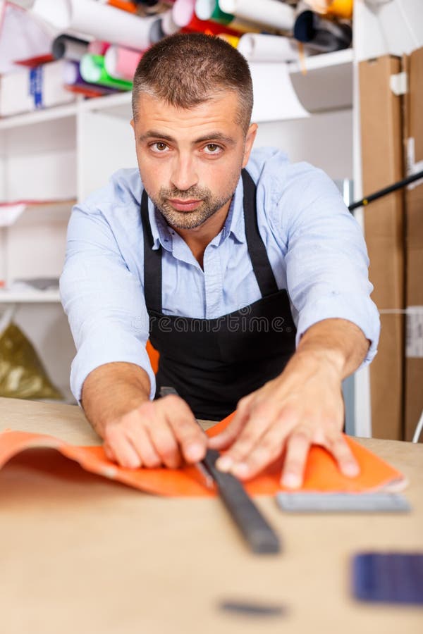 Man Cuts Off Piece of Colored Paper Stock Photo - Image of printer ...