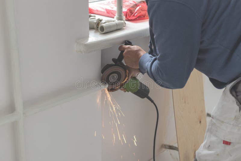 Man Cuts a Pipe with a Grinder Sparks Fly Stock Photo - Image of pipe ...