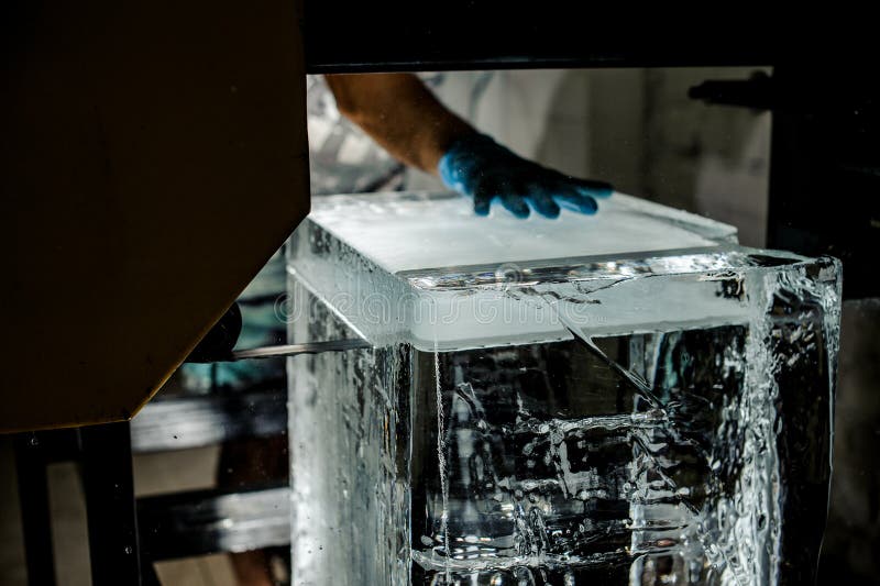 Cutting an Ice Cube with a Special Machine Knife on the Plant Stock ...