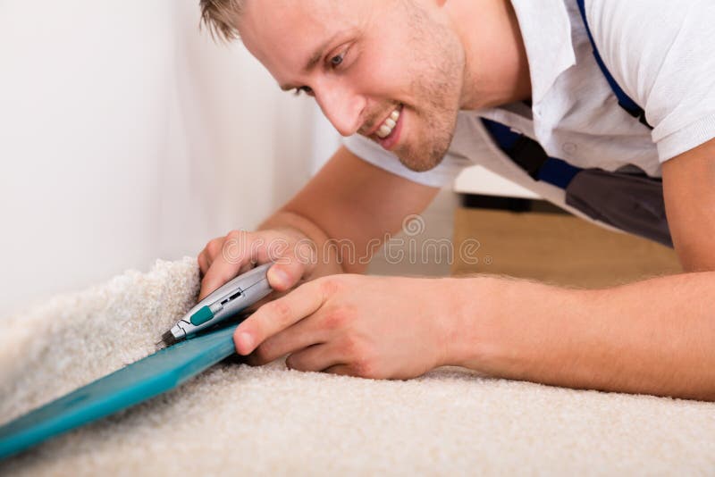 Man Cutting Carpet with Cutter Stock Image - Image of fitting, cutting ...