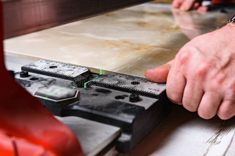 Man Cutting Ceramic Tile with Manual Tile Cutter. Stock Image - Image ...