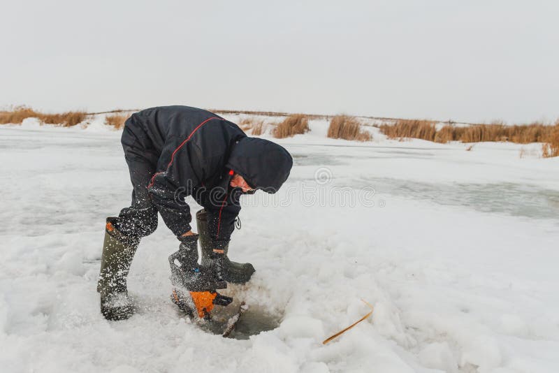 Man Cutting Chainsaw Shell in Ice Stock Image - Image of nature, auger ...