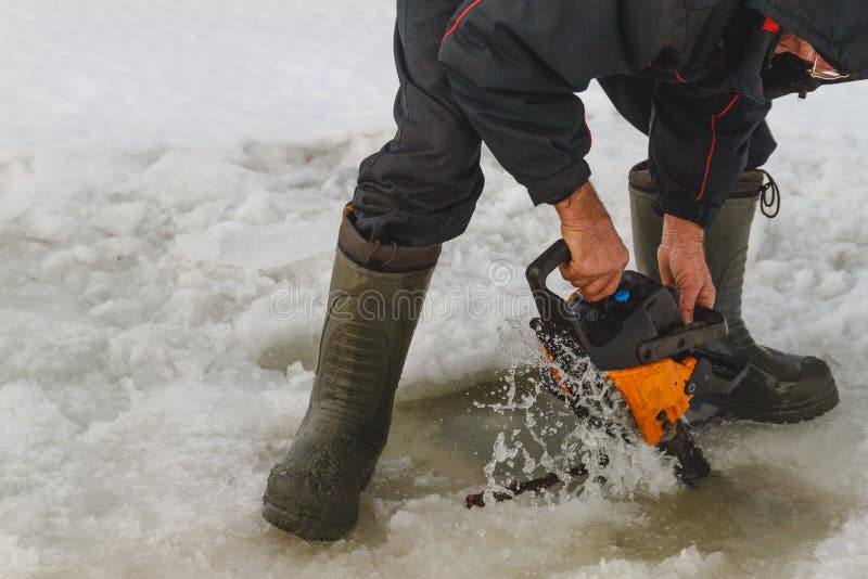 Man Cutting Chainsaw Shell in Ice Stock Photo - Image of hood ...