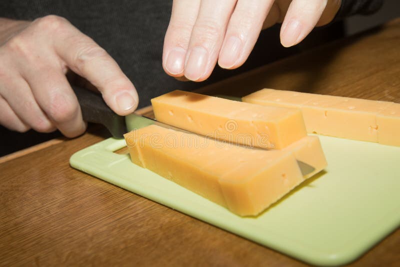Man Cutting A Slice Of Cheese Stock Photo - Image of france, yummy ...