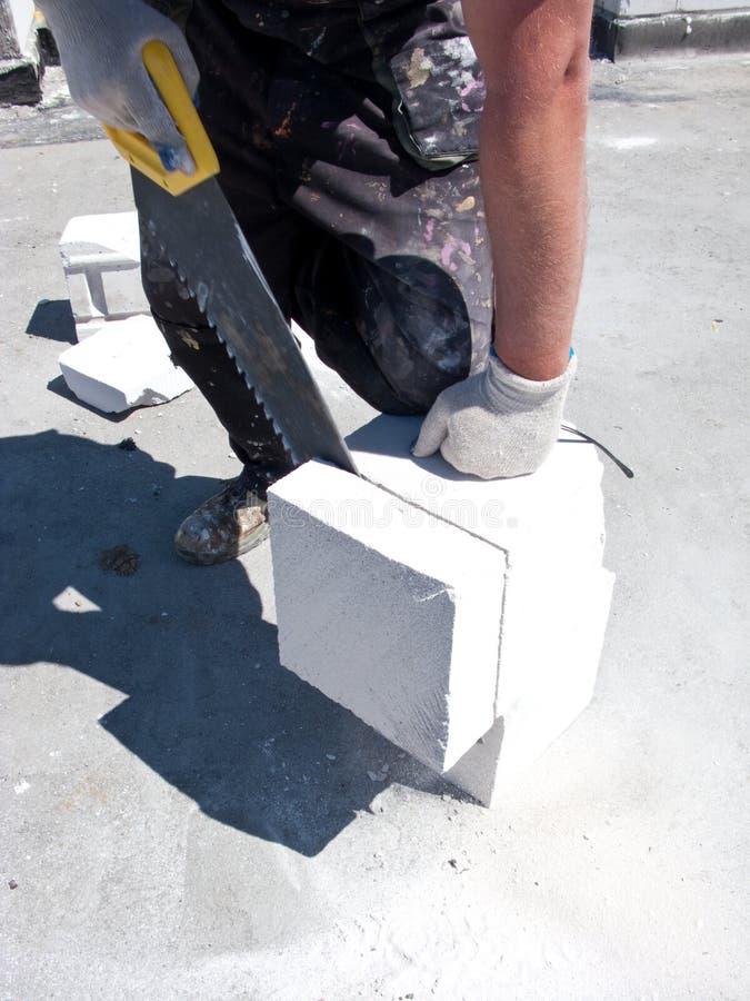 Man sawing concrete block stock image. Image of manually - 19685867