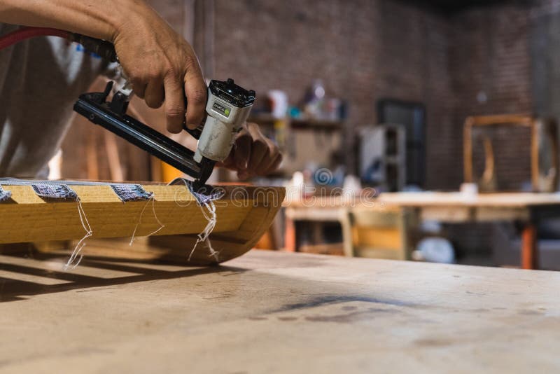 Man cutting foam rubber stock image. Image of person - 204975263