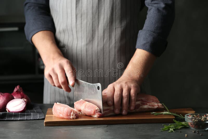 Man Cutting Fresh Raw Meat on Grey Table Stock Photo - Image of market ...