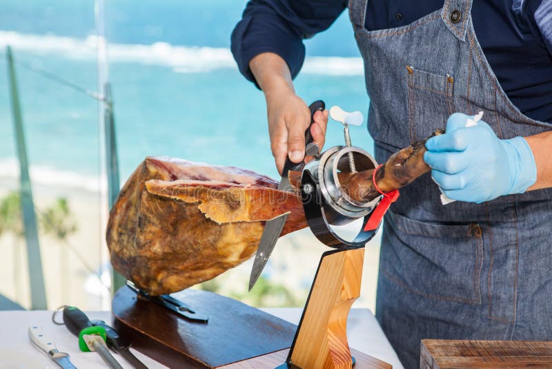Man cutting ham stock image. Image of iberian, spanish - 144907231